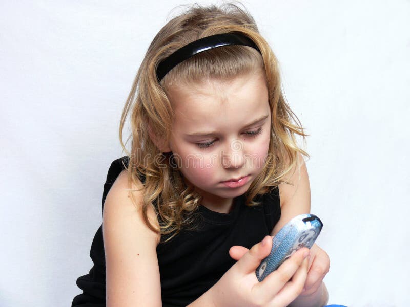 Little Girl Texting stock photo. Image of girly, blond - 20506050