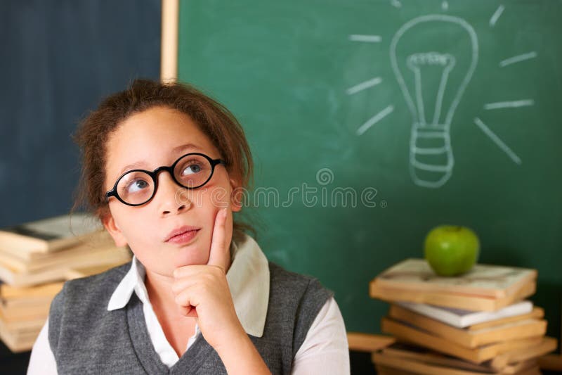 School Child Thinking Near Chalkboard in Classroom. Kid Girl at ...