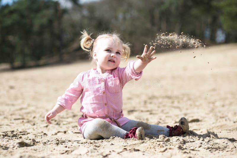 Child Throwing Sand in the Forest Stock Photo - Image of outdoor ...