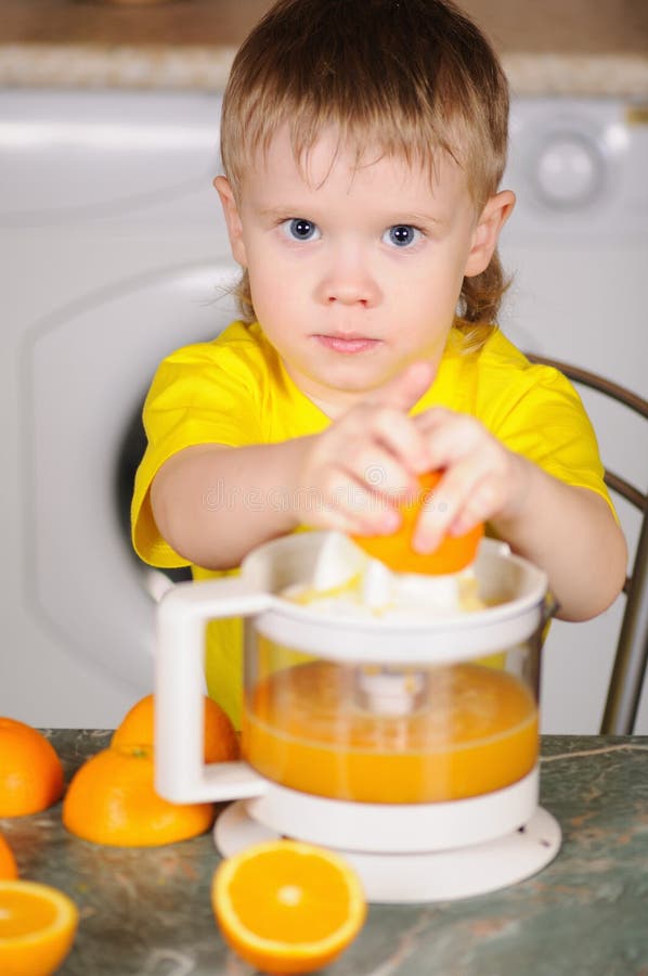 The Child To Wring Out Juice Stock Image - Image of enjoying, happy ...