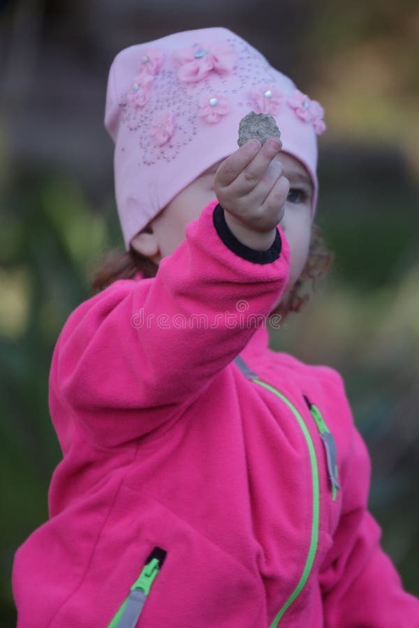 Child Took a Small Stone in His Hand and Pulled it Upward Stock Image ...
