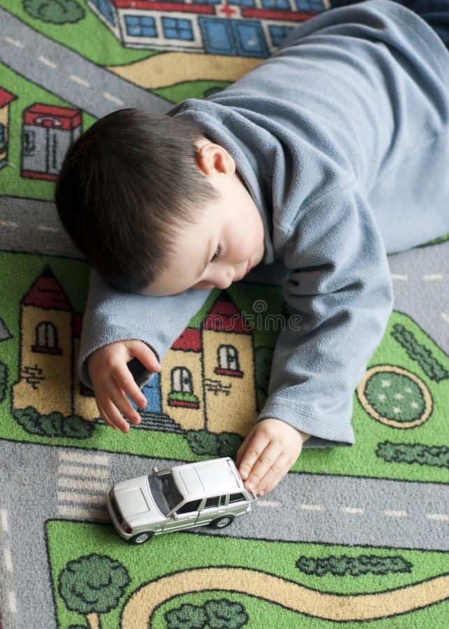 Child with toy car stock photo. Image of kindergarten - 23741548