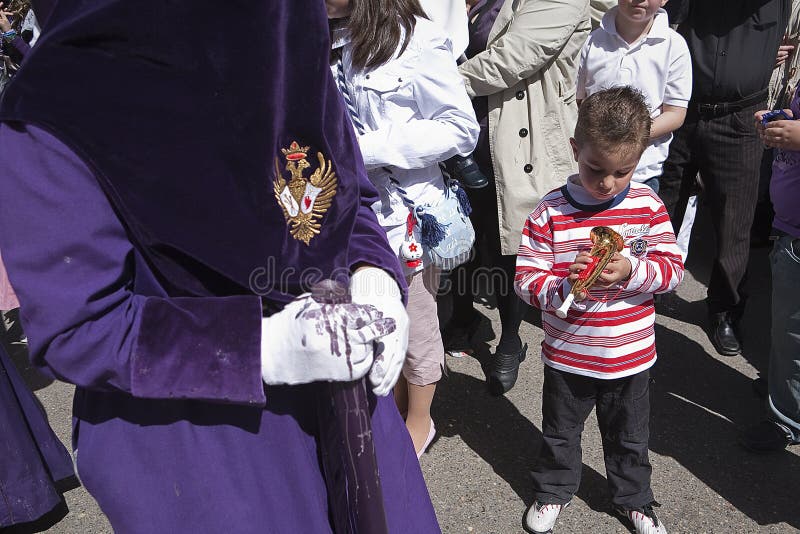 Child with a Toy Trumpet during a Procession of Holy Week Editorial ...