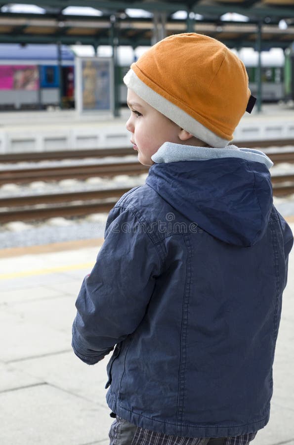 Child waiting at bus stop stock photo. Image of sitting - 34822954