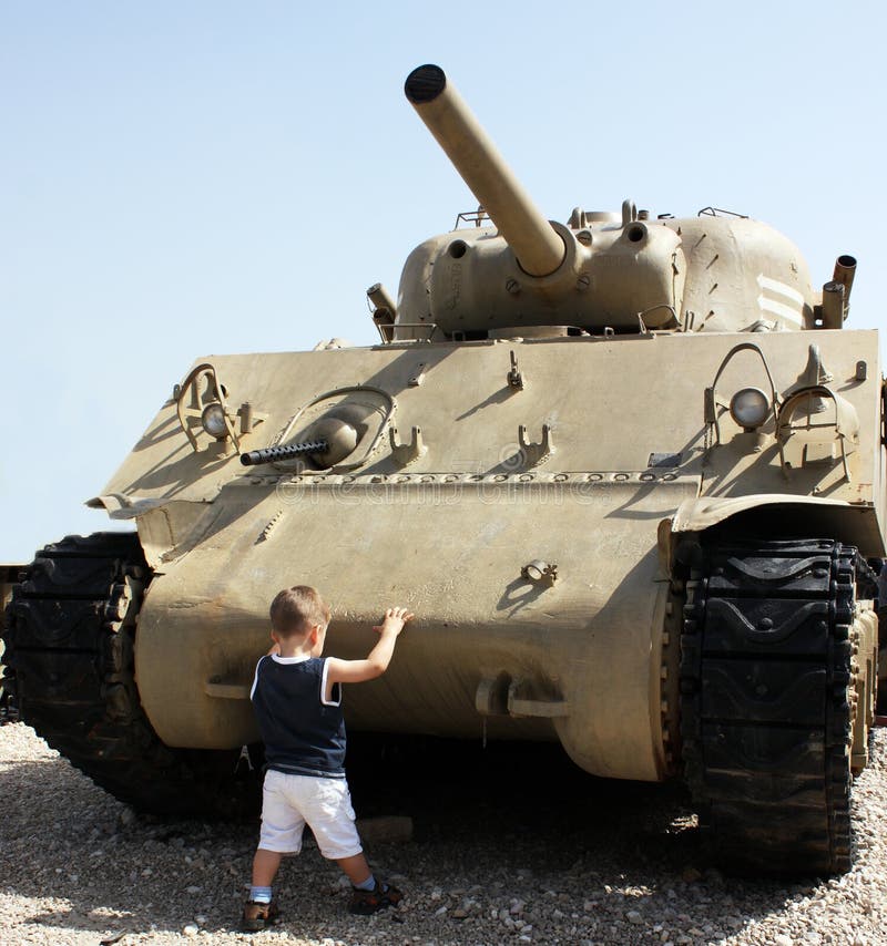 Child tries to stop tank stock photo. Image of game, stop - 13776404