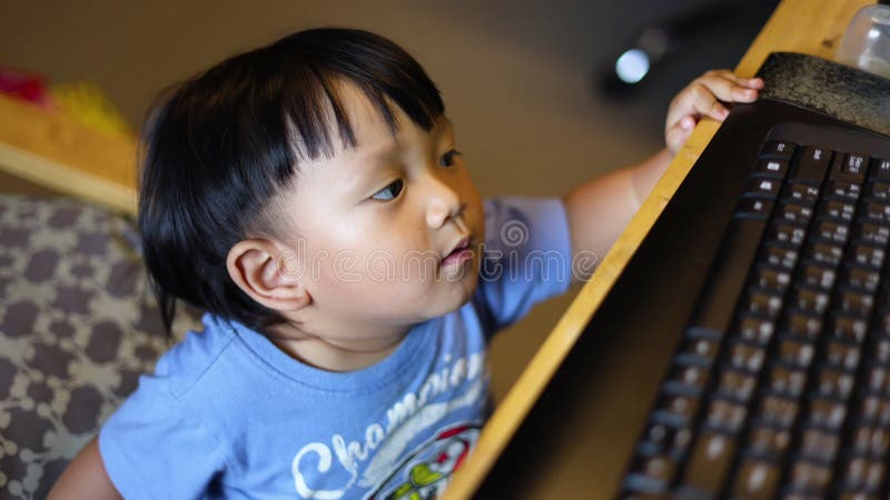 Child is Trying To Play the Keyboard Stock Video - Video of office ...