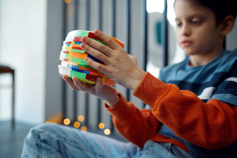 Child Trying To Solve Difficult Puzzle Cube Editorial Stock Photo ...