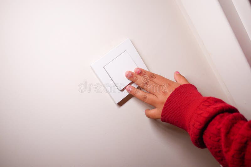 Child Turns on Light Switch in a Cozy Room Stock Photo - Image of ...