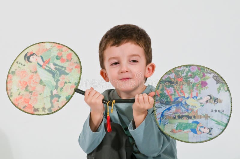 Child with Two Fans in Hand Stock Photo - Image of smile, faces: 57689228