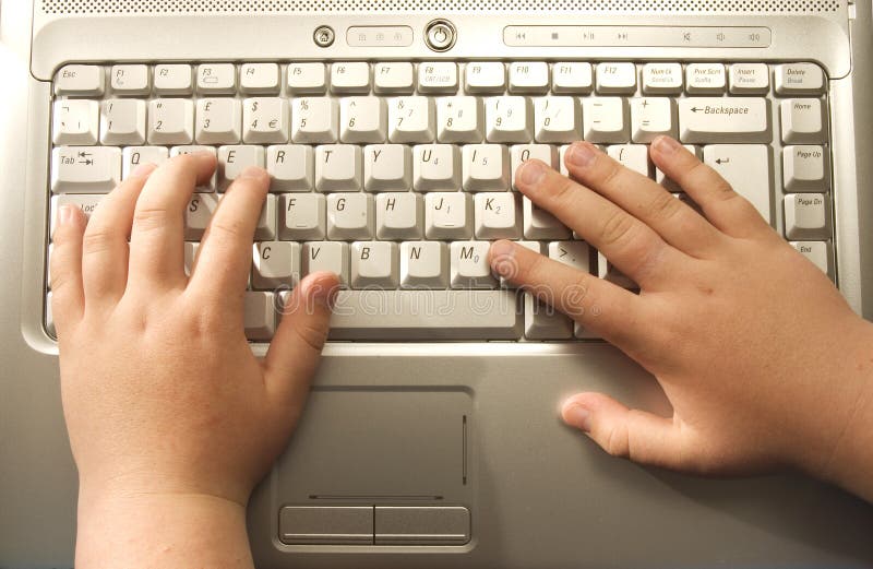 Child Typing on Computer Keyboard for Remote Learning Lesson at Home ...