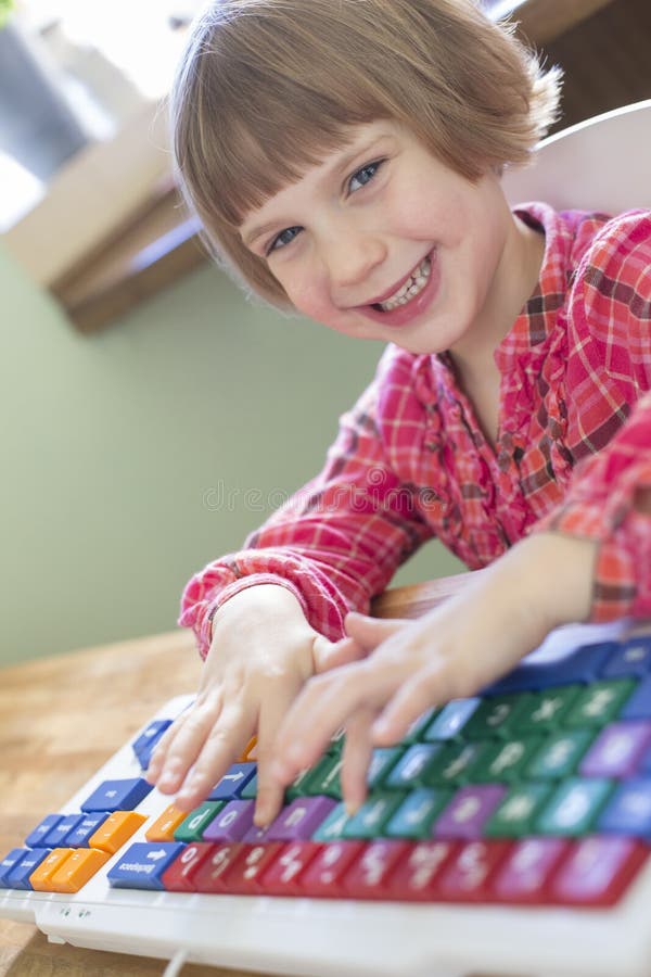 Child Typing on Colourful Computer Keyboard Stock Image - Image of ...