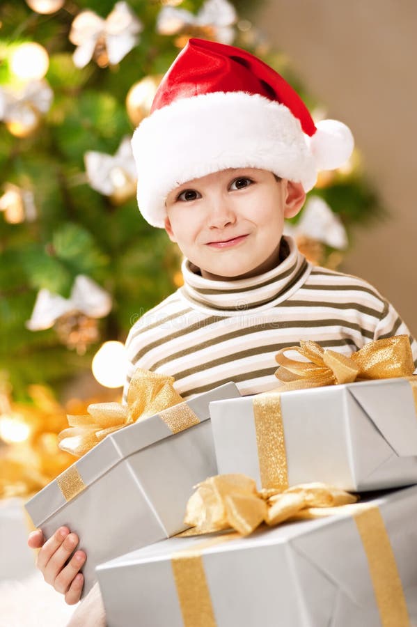 Child Under the Christmas Tree with Gifts Stock Photo - Image of ...