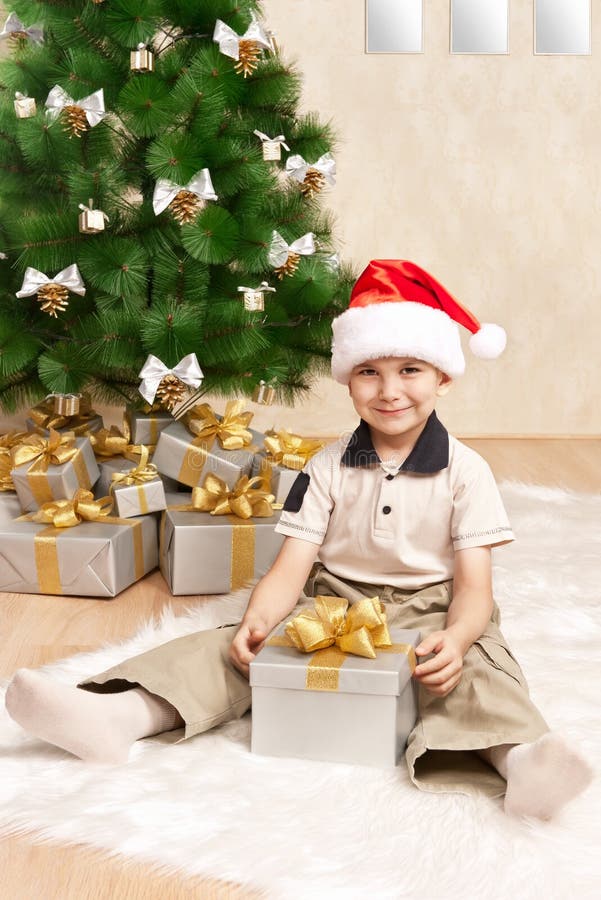 Child Under the Christmas Tree with Gifts Stock Photo - Image of smile ...