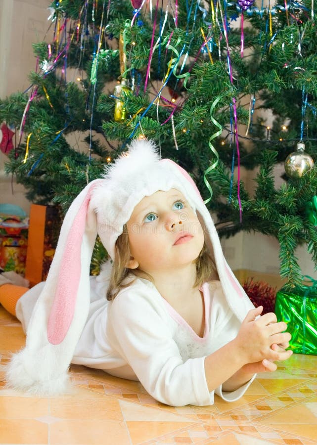 The child under a fur-tree stock image. Image of waits - 12678243