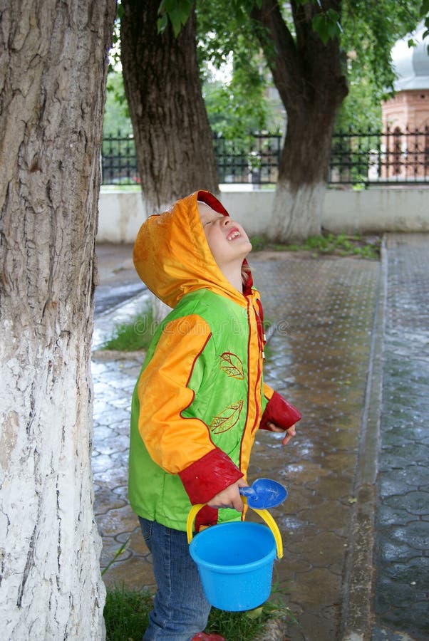 Child under tree stock image. Image of look, trunk, girl - 24999579
