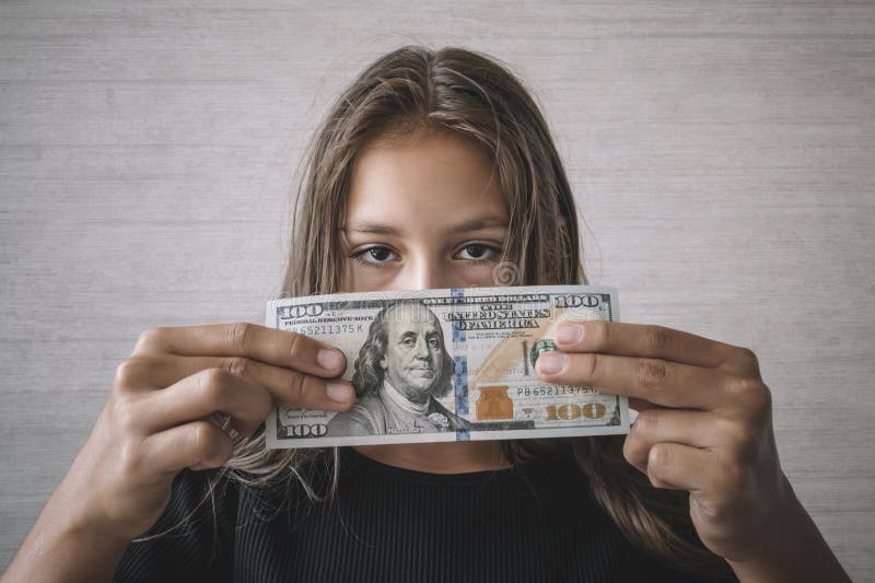 Child and US Dollars. Concept - Development of Materialism from ...