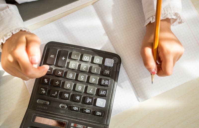 Child Using Calculator while Doing Homework Stock Image - Image of ...