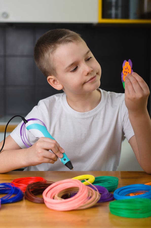 Child Using 3D Pen. Happy Boy Making Flower from Colored ABS Plastic ...