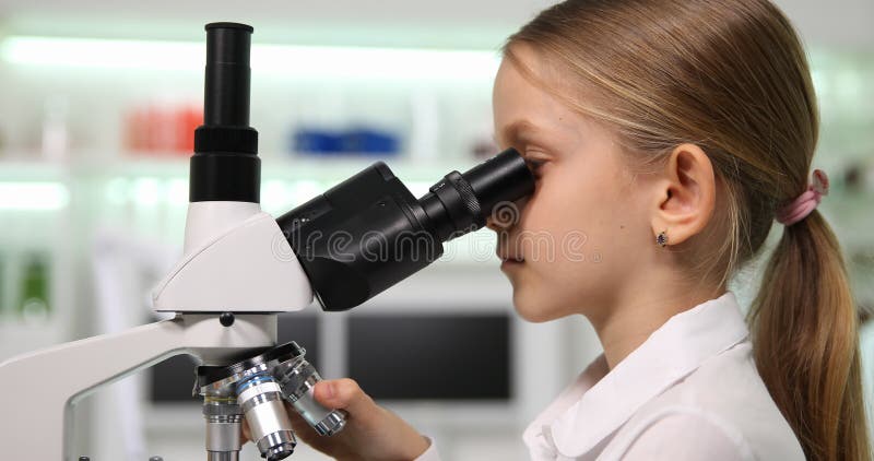 Child Using Microscope in School Chemistry Lab, Student Studying ...