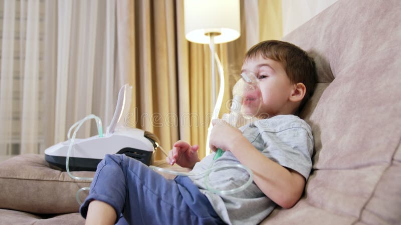 Child Using Nebulizer at Home. Stock Footage - Video of caregiver ...