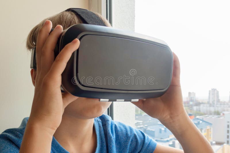 Child using new VR glasses stock image. Image of reality - 90814859