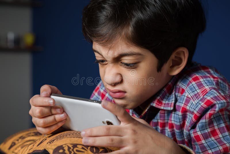 Child Using a Smart-phone with Funny Expression. Stock Image - Image of ...