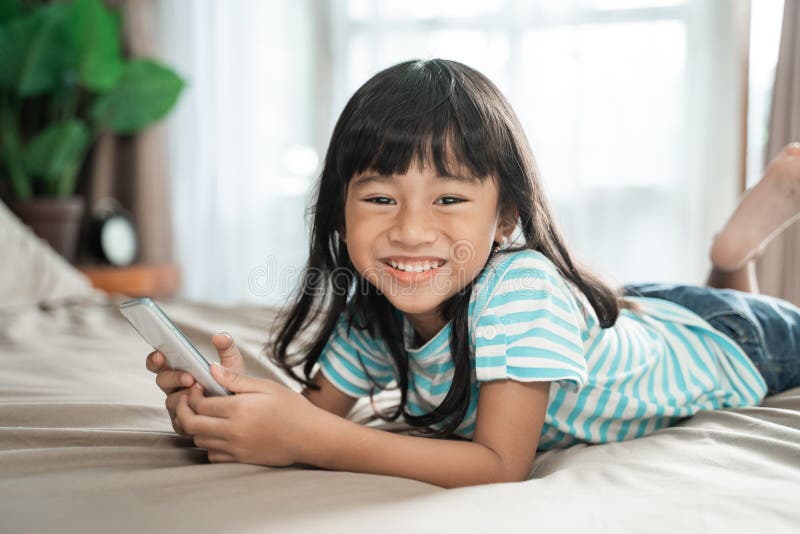 Child Using Smartphone at Home Stock Image - Image of addicted, girl ...