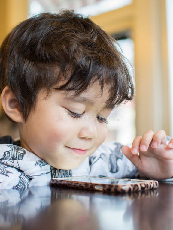 Child using smartphone stock photo. Image of child, interact - 66253652