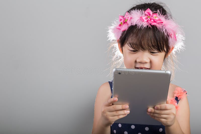Child Using Tablet Background. Girl Playing Tablet Background Stock ...