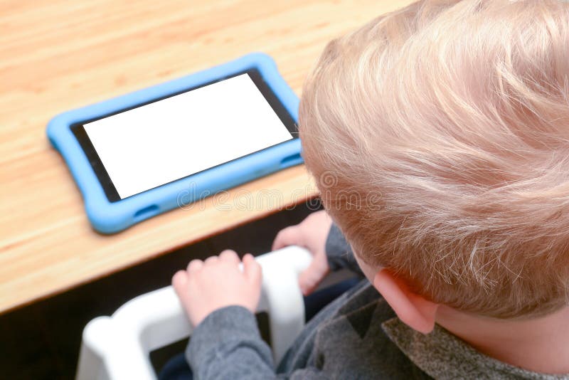 Child Using a Tablet Computer To Learn and Play Games, Model is Young ...