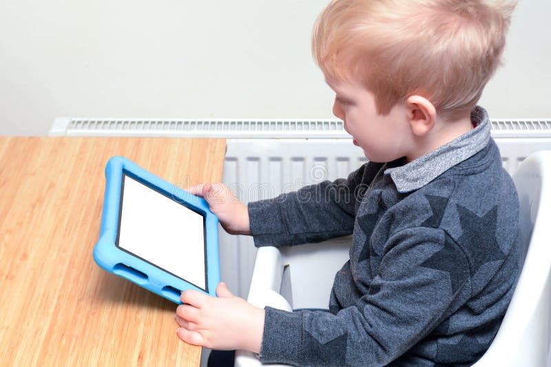 Child Using a Tablet Computer To Learn and Play Games, Model is Young ...