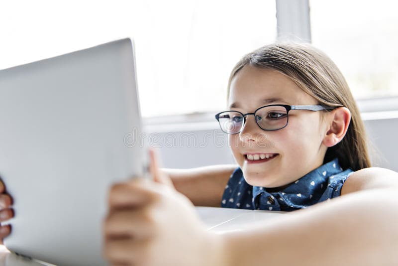 A Cute Child Using Tablet at School Stock Image - Image of notebook ...