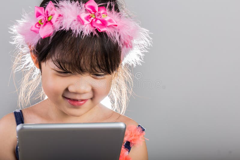 Child Using Tablet / Young Girl with Tablet Background Stock Photo ...