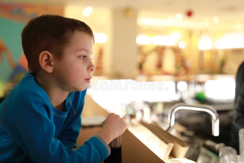 Child Waiting Food at Bar of Restaurant Stock Image - Image of ...