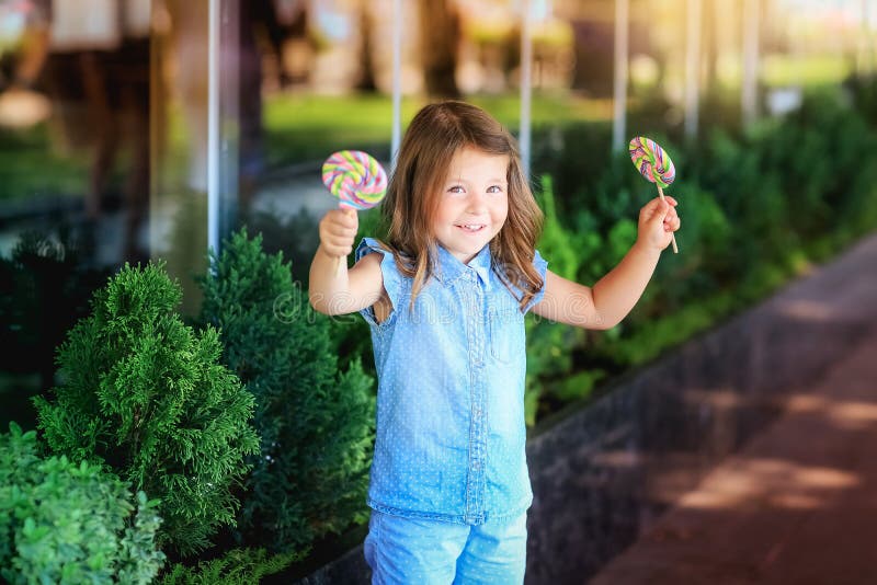 Child for a Walk in the Park with Candy in Hand Stock Image - Image of ...