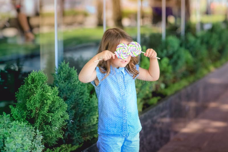 Child for a Walk in the Park with Candy in Hand Stock Photo - Image of ...