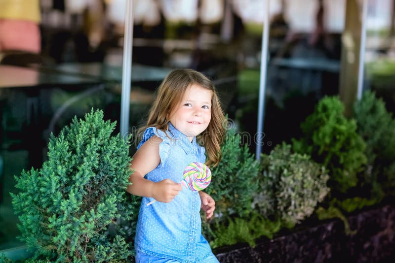 Child for a Walk in the Park with Candy in Hand Stock Photo - Image of ...