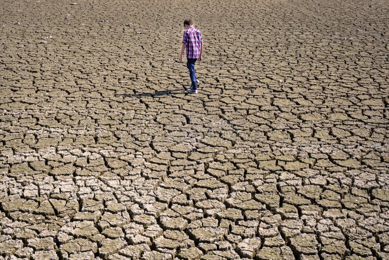 Child walking on dry land stock photo. Image of ecosystem - 66090814