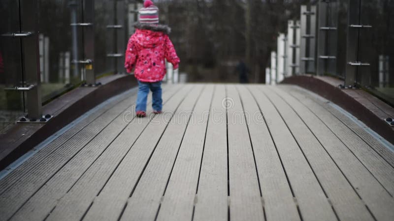 Child Walking Barefoot in Snow. Close-up of Childs Bare Feet. Hardening of Body by Walking in ...