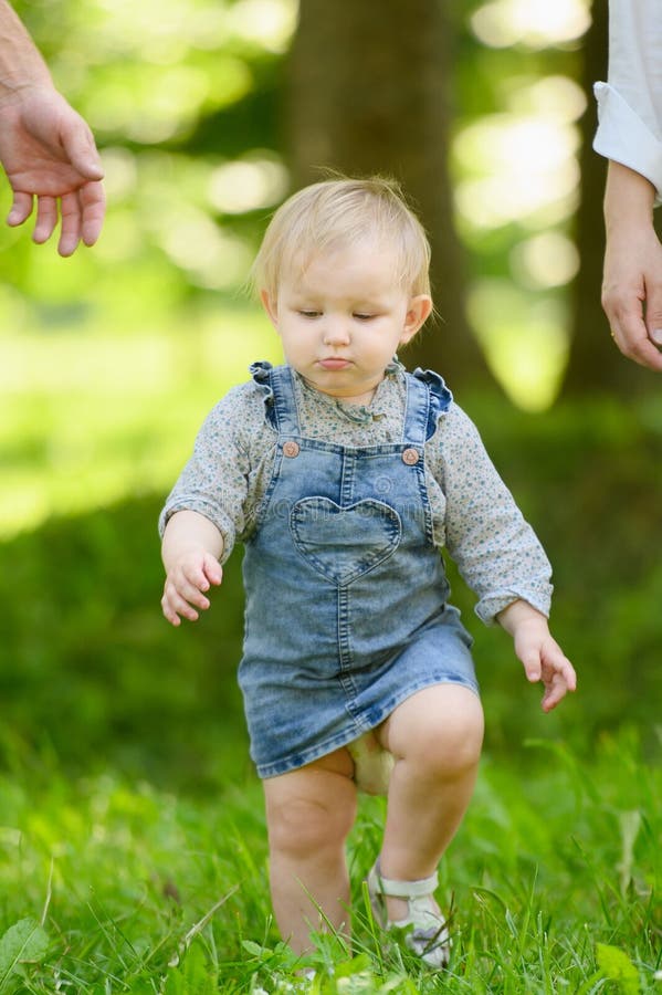 Child Learns To Walk, Takes His First Steps, Walks in the Park on the ...