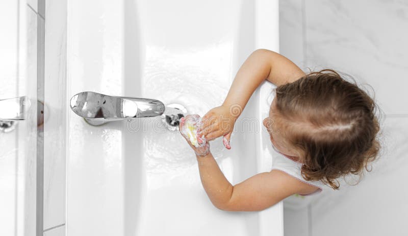 The Child Washes His Hands Under the Tap. Stock Image - Image of ...