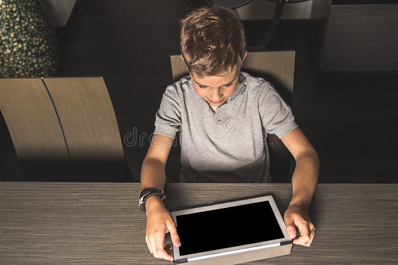 Child Watching a Tablet at Home Stock Photo - Image of race, lifestyle ...