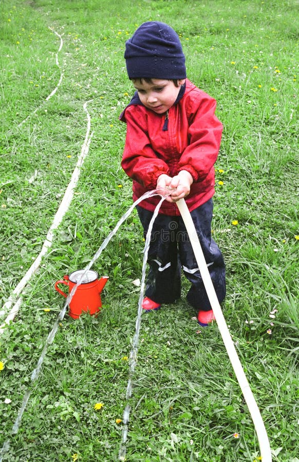 Child Watering Just Planted Tree. Children Will Save the Earth Stock ...