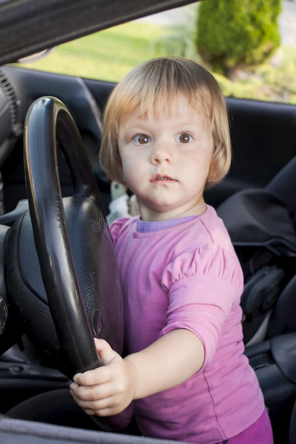 The Child at the Wheel the Car Stock Photo - Image of wheel, travel ...