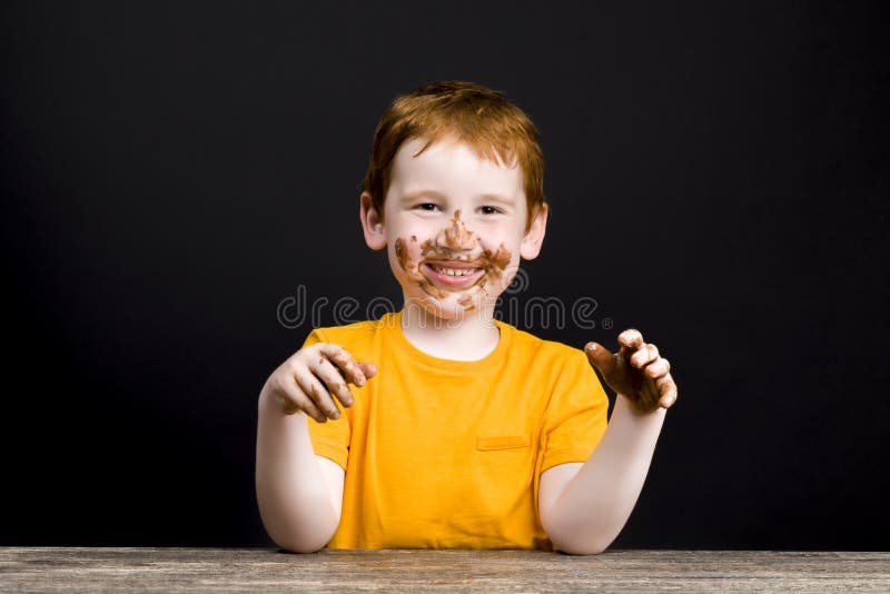 The Child in Whose Hands Melted Chocolate Stock Photo - Image of melted ...
