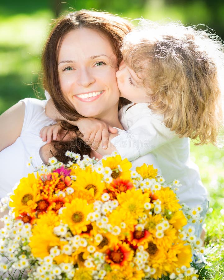 Child and Woman with Bouquet of Flowers Stock Photo - Image of giving ...