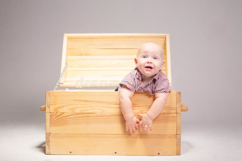 Child in a wooden box stock image. Image of horizontal - 27150021
