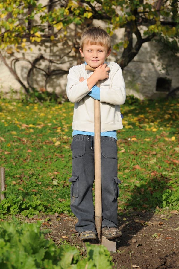 Child working in garden stock image. Image of young, hardworking - 27347399