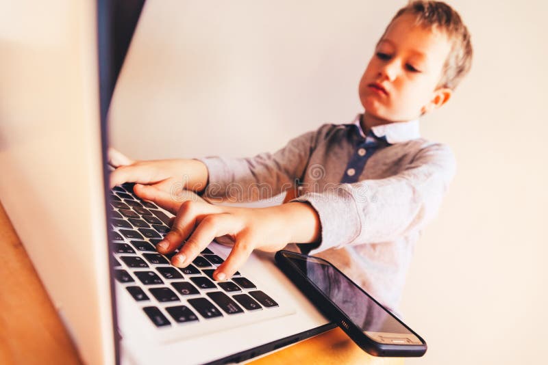 Child Working with His Computer in His Business, Concentrated Typing To ...