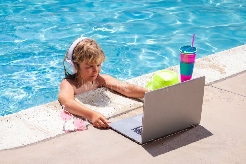 Child Working with Laptop on Summer Vacation Holidays. Little ...